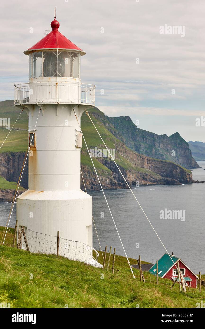 Mykines lighthouse and cliffs on Faroe islands. Hiking landmark ...