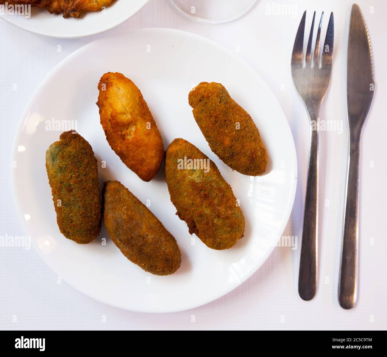 Plate with croquettes of ham, typical Spanish dish Croquetas caseras ...