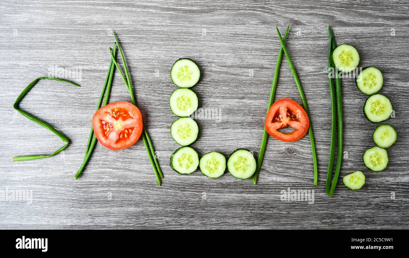Word SALAD made of green onion cucumber and tomato, healthy vegan ...
