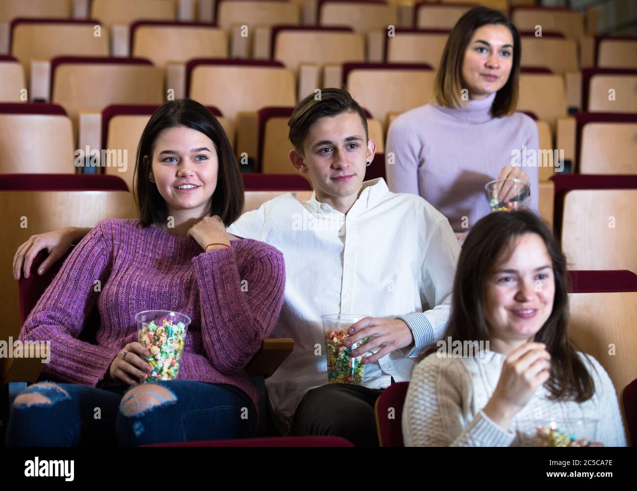 Watching intently a show hi-res stock photography and images - Alamy
