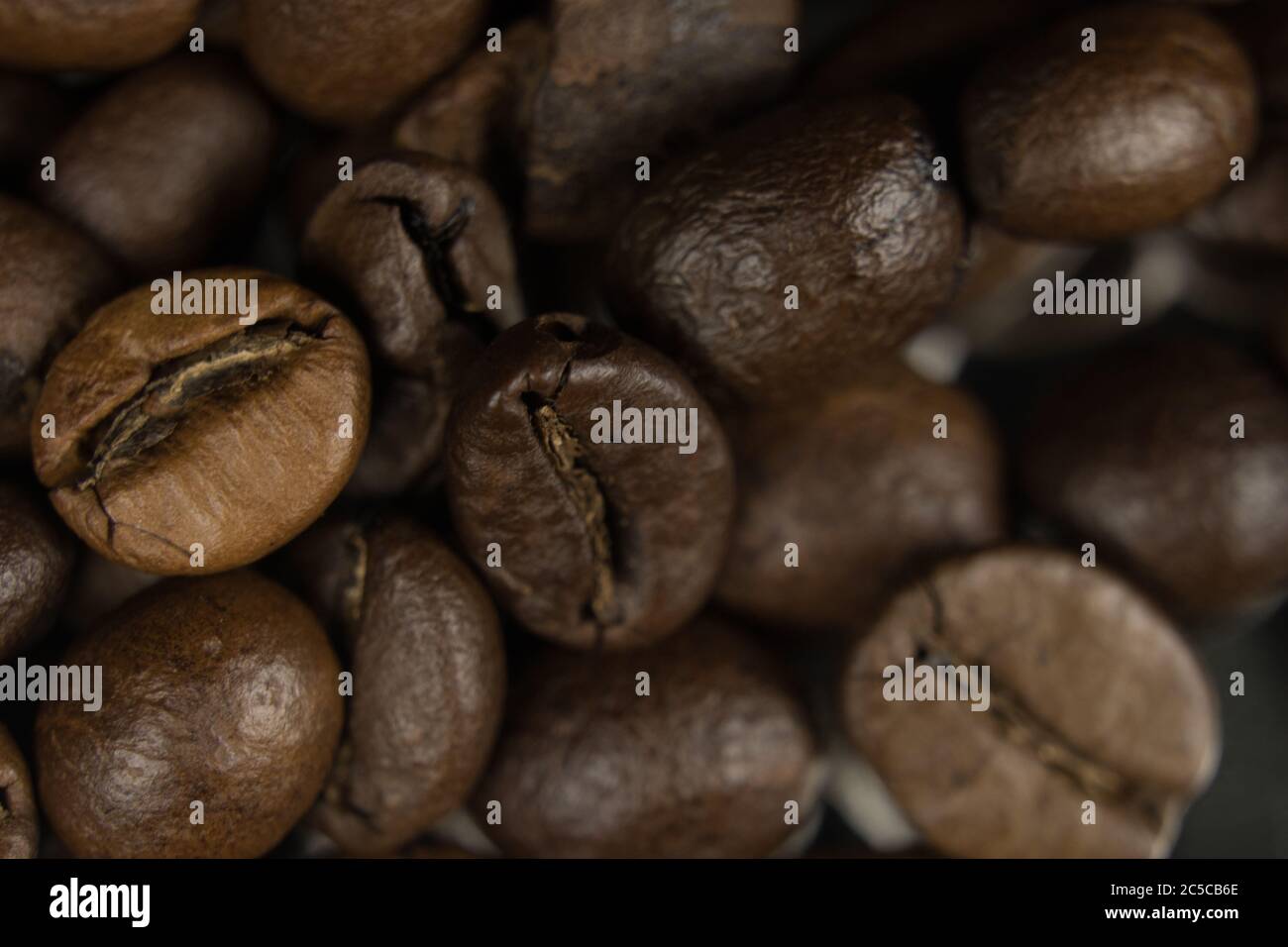 Fragrant fried coffee beans. close-up Stock Photo - Alamy