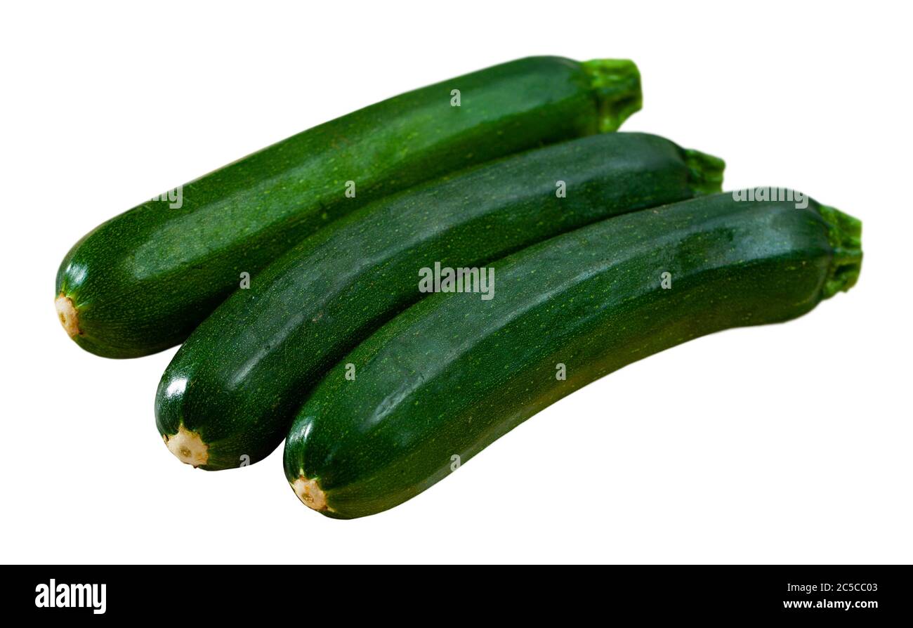 Fresh green courgettes. Vegetarian food concept. Isolated over white ...