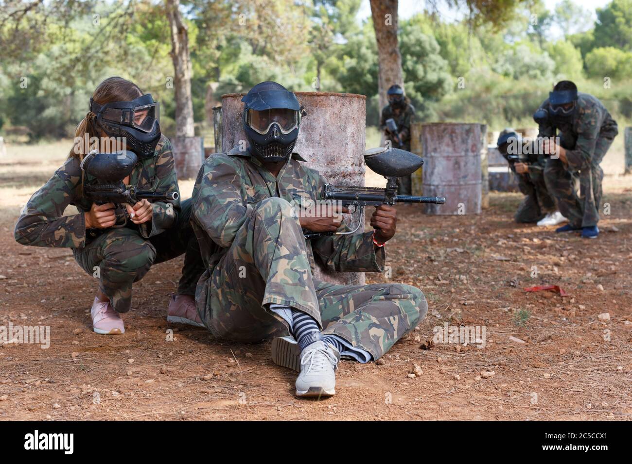Teams facing on battlefield in outdoor paintball zone in summer Stock ...