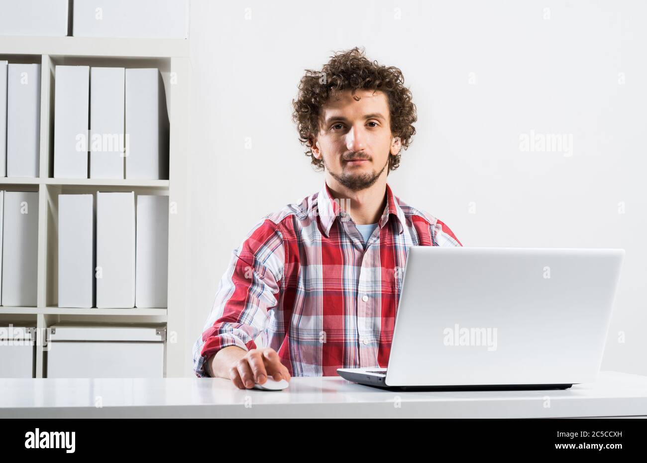 Man working in office Stock Photo - Alamy
