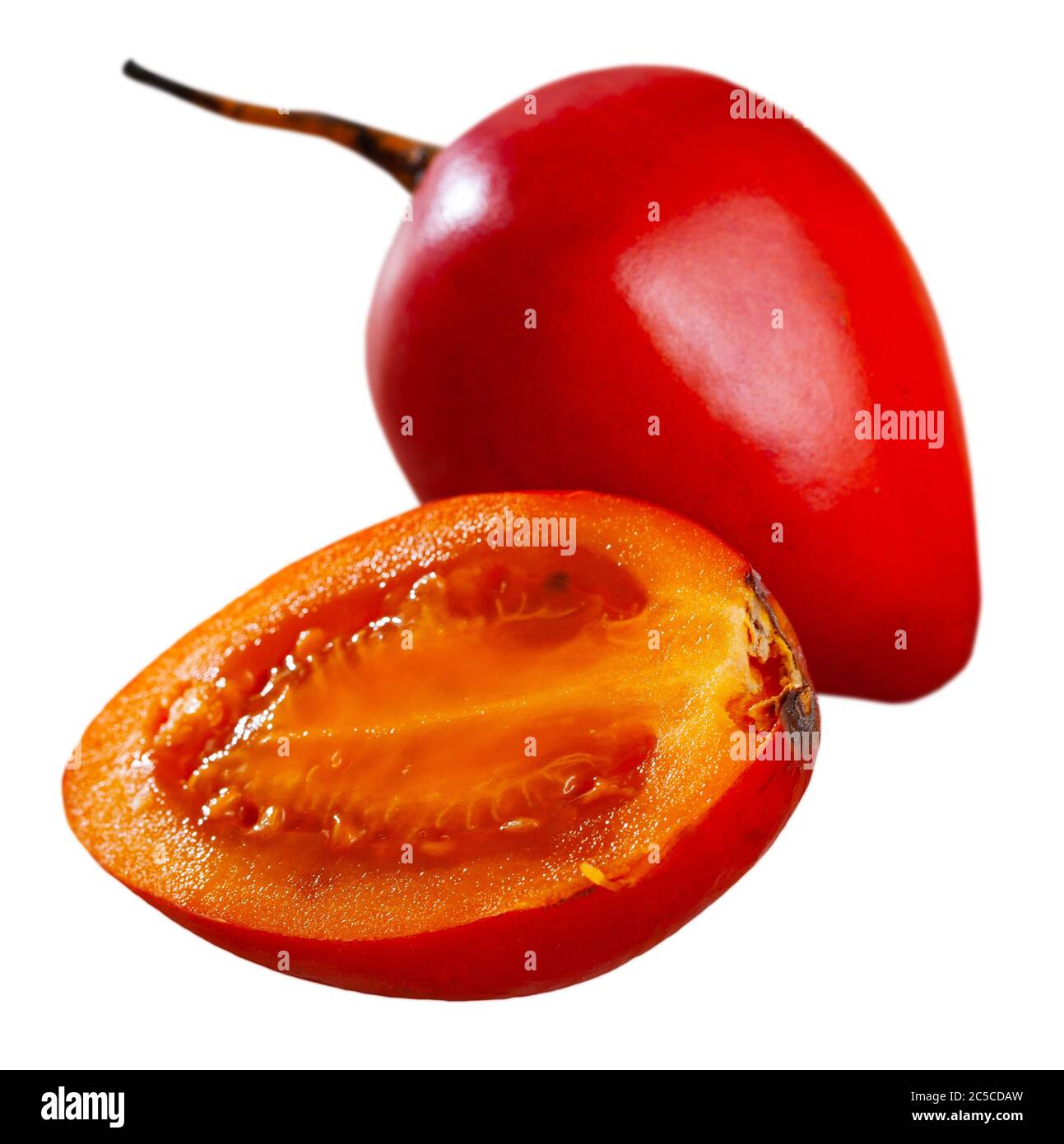 Whole and half fresh red tamarillo. Healthy vegetarian ingredient ...