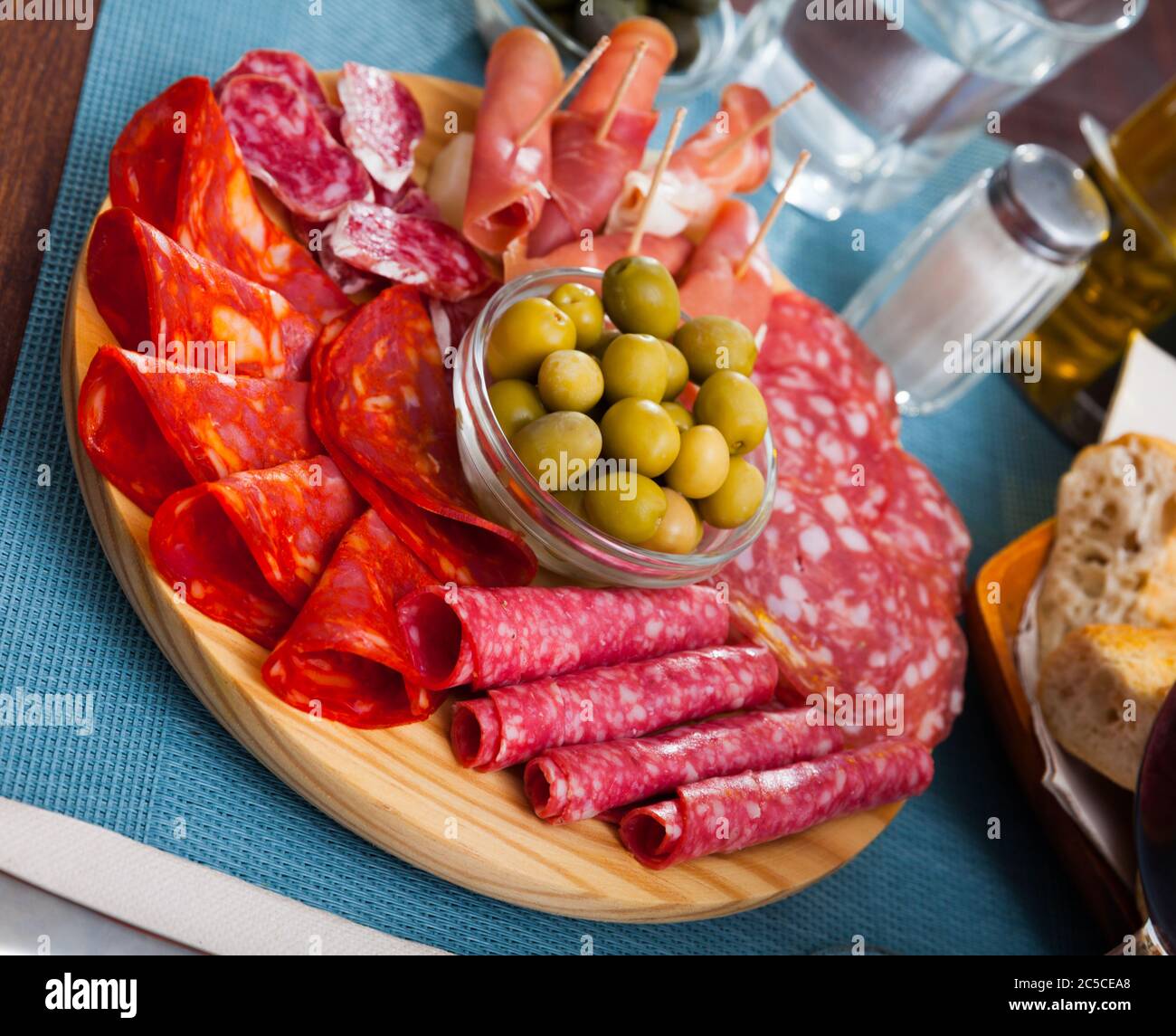Slices of Spanish dry-cured gammon and variety of sausages served with ...
