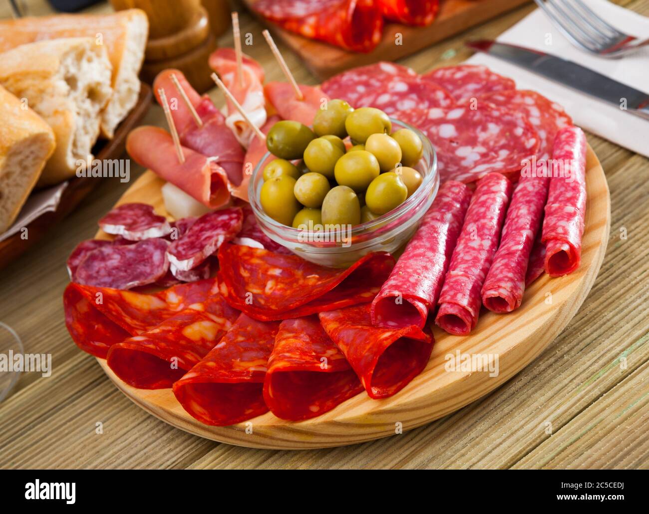 Cold smoked meat plate with traditional Spanish chorizo, fuet and ...