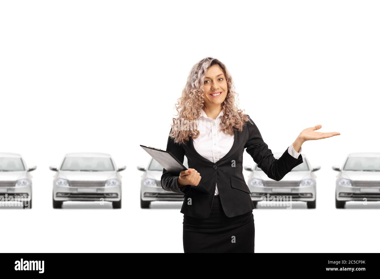 Female host in a car showroom gesturing welcome isolated on white ...