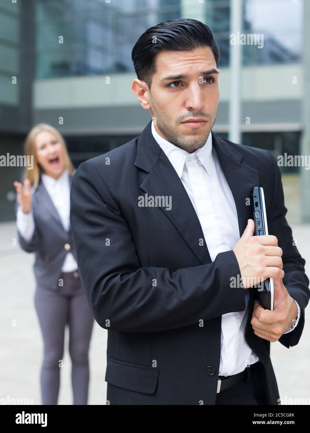 Employee is upset with the reprimand of woman boss near office Stock ...