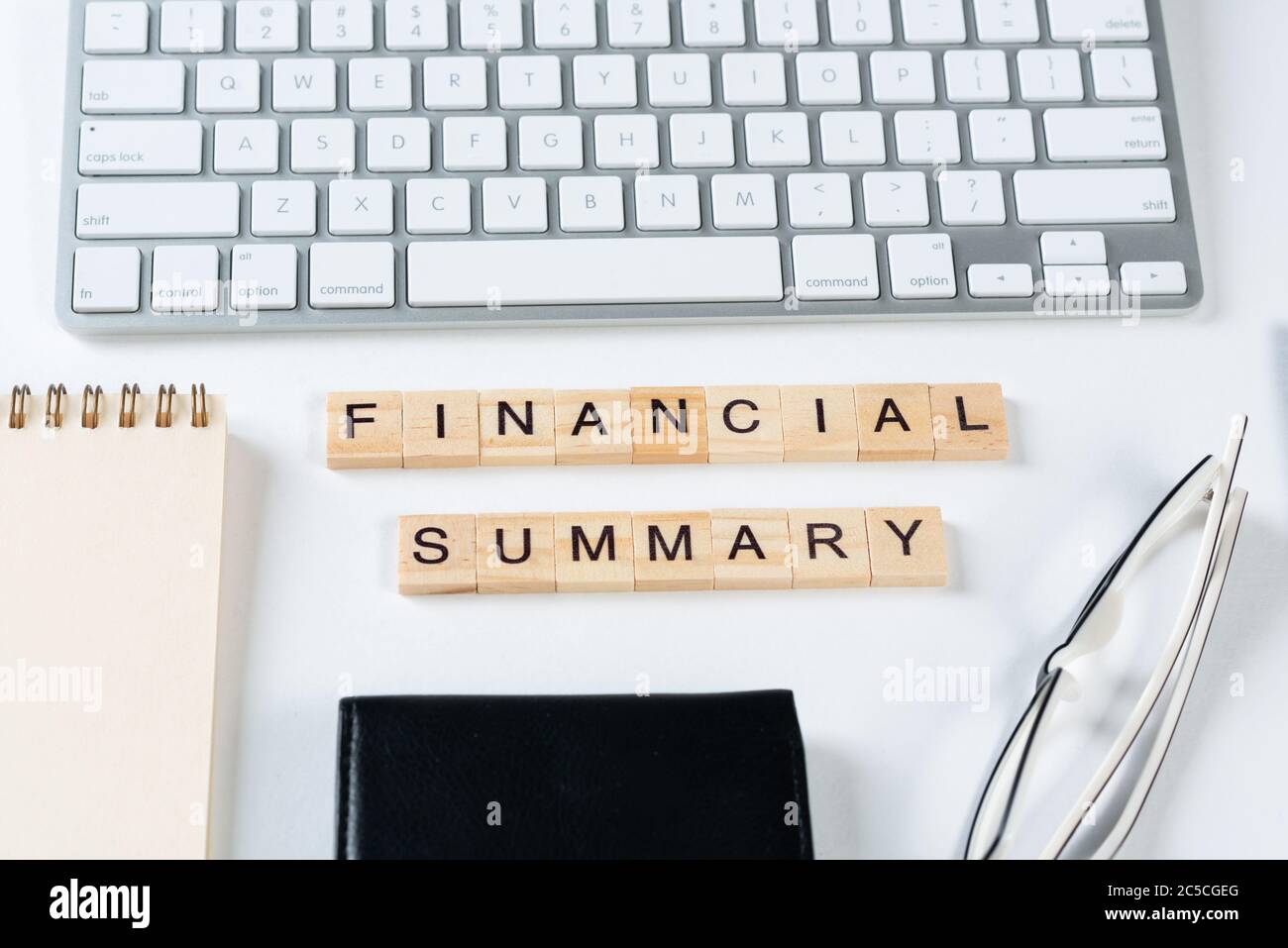 Financial summary concept with letters on cubes Stock Photo - Alamy