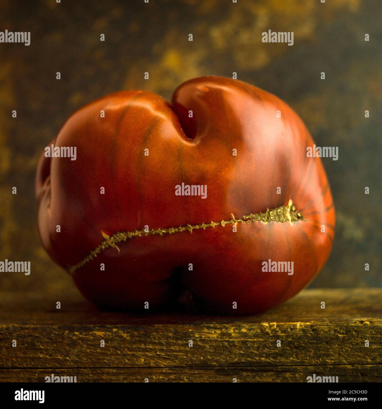 Deformed red tomato Stock Photo - Alamy