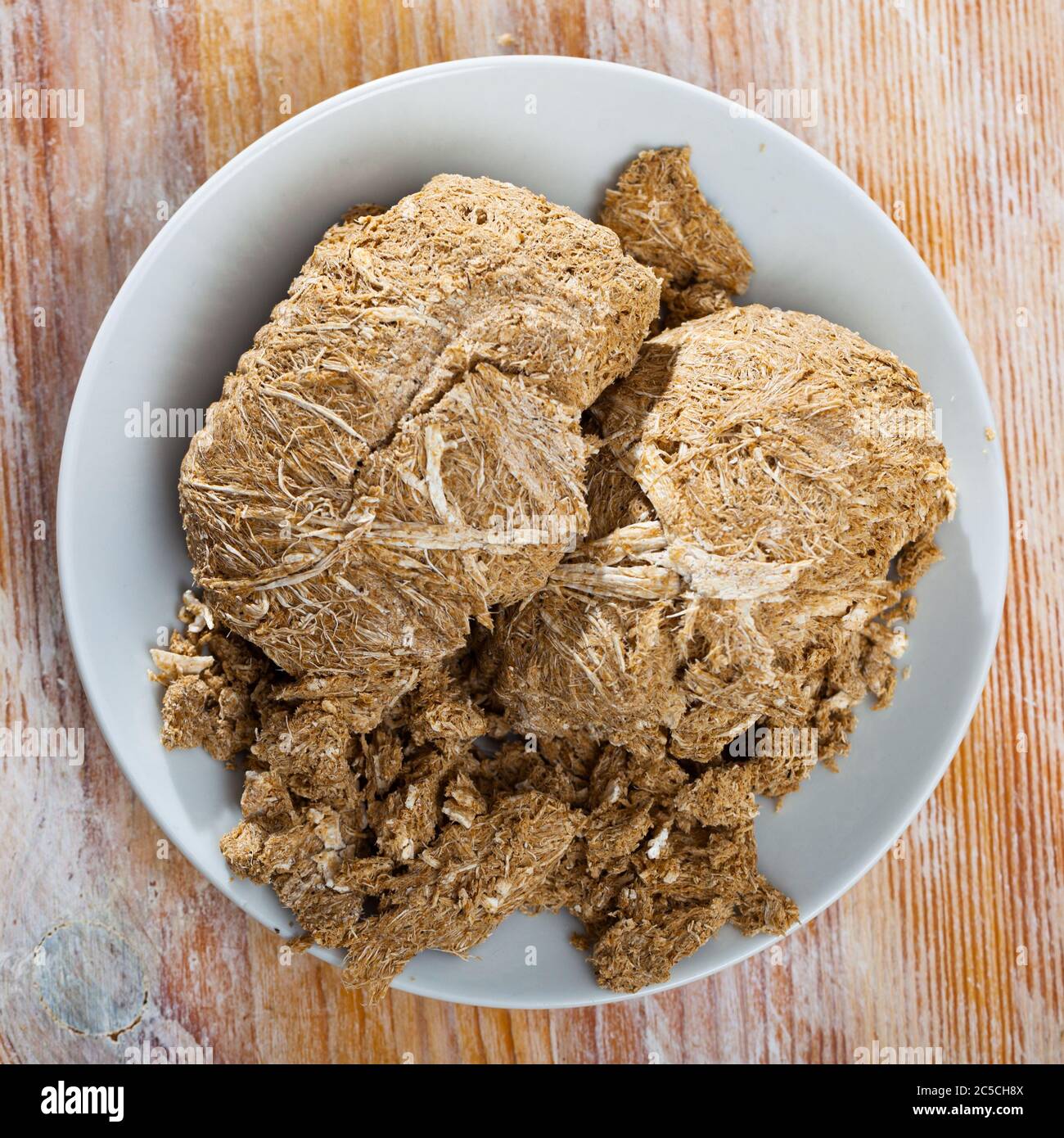 Traditional russian dessert halva from sunflower at plate on table ...