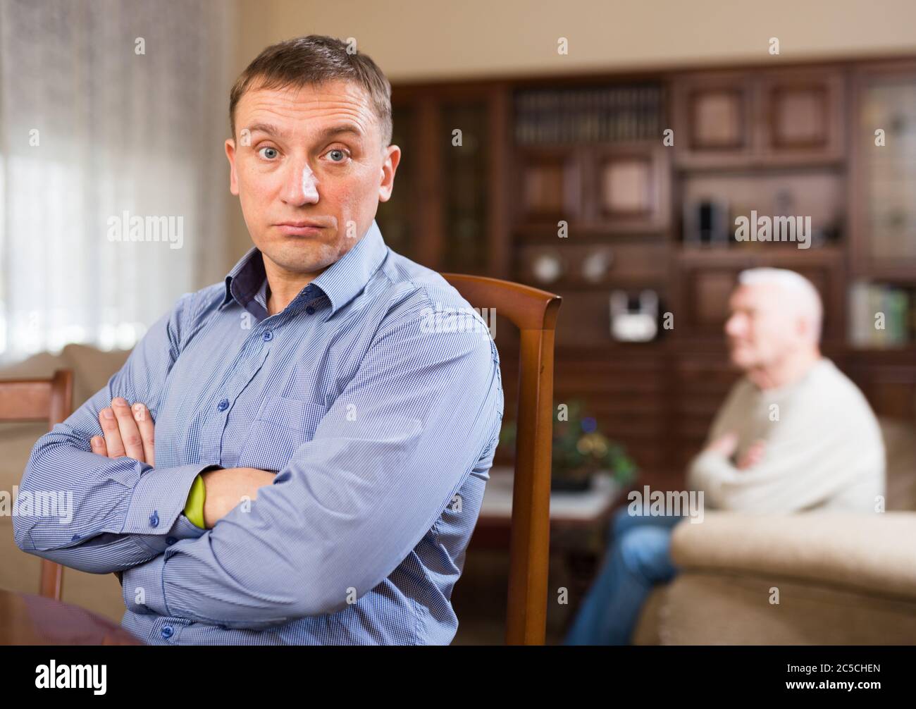 Adult son and elderly father are offended at each other because of the ...