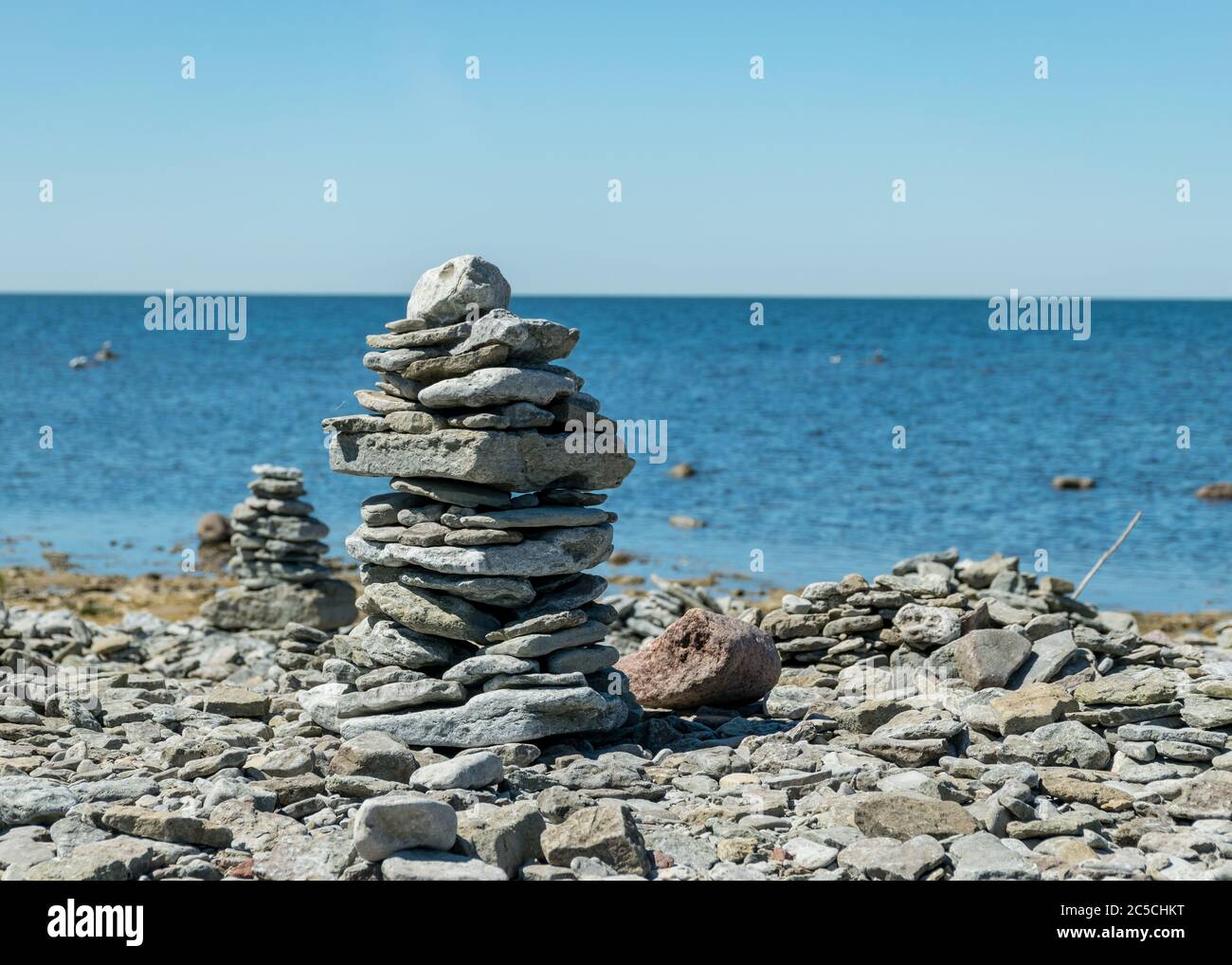 picture with beautiful white stone piles by the sea, these objects were ...
