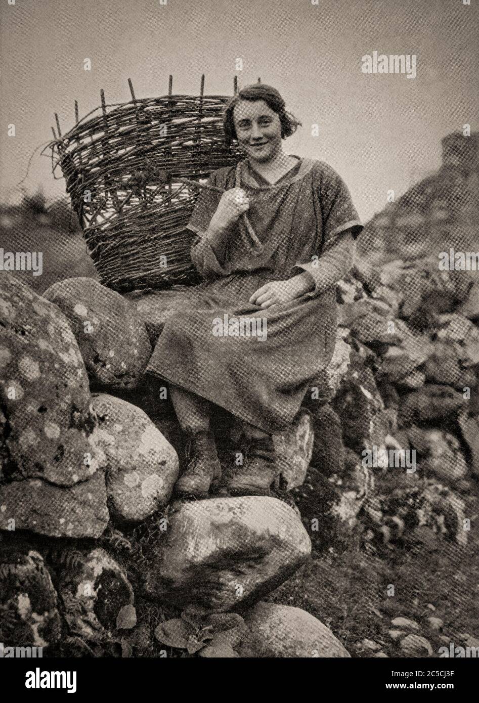 An early 1920's view of an Irish woman with her creel basket, in ...