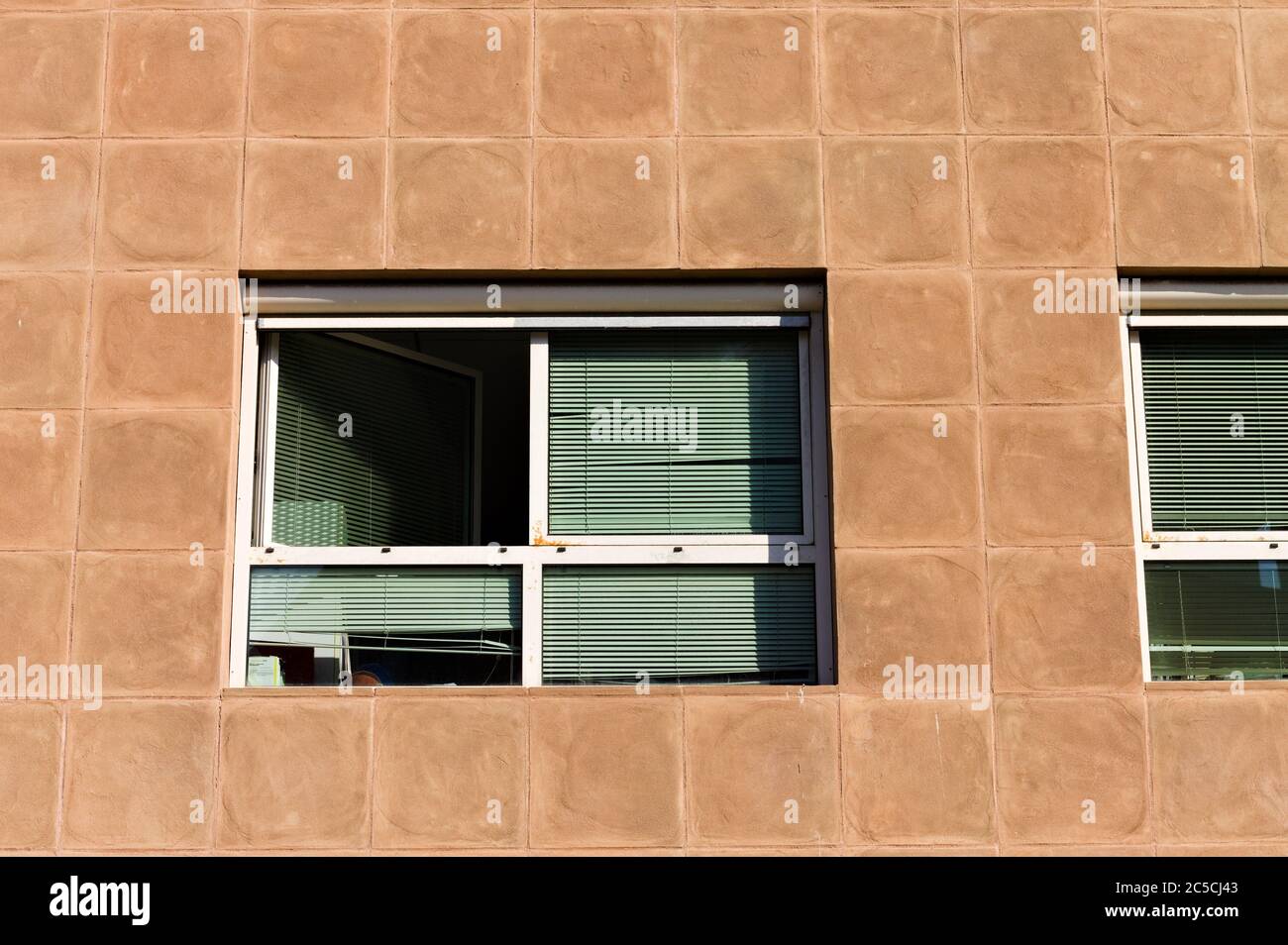 Rectangular windows of a modern building with terracotta walls (Pesaro ...