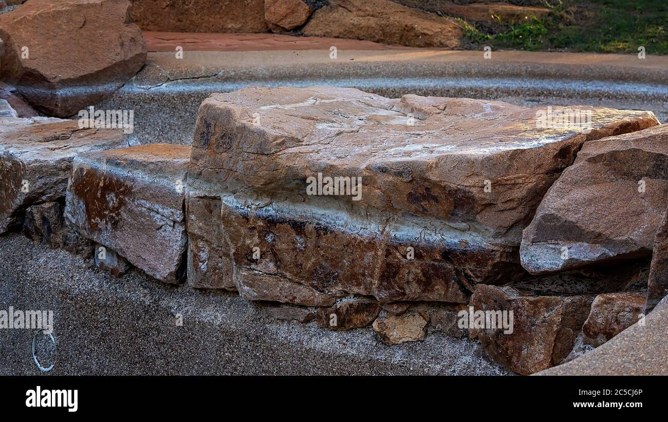 The volcanic rock edge of a guest swimming pool emptied during covid-19 ...