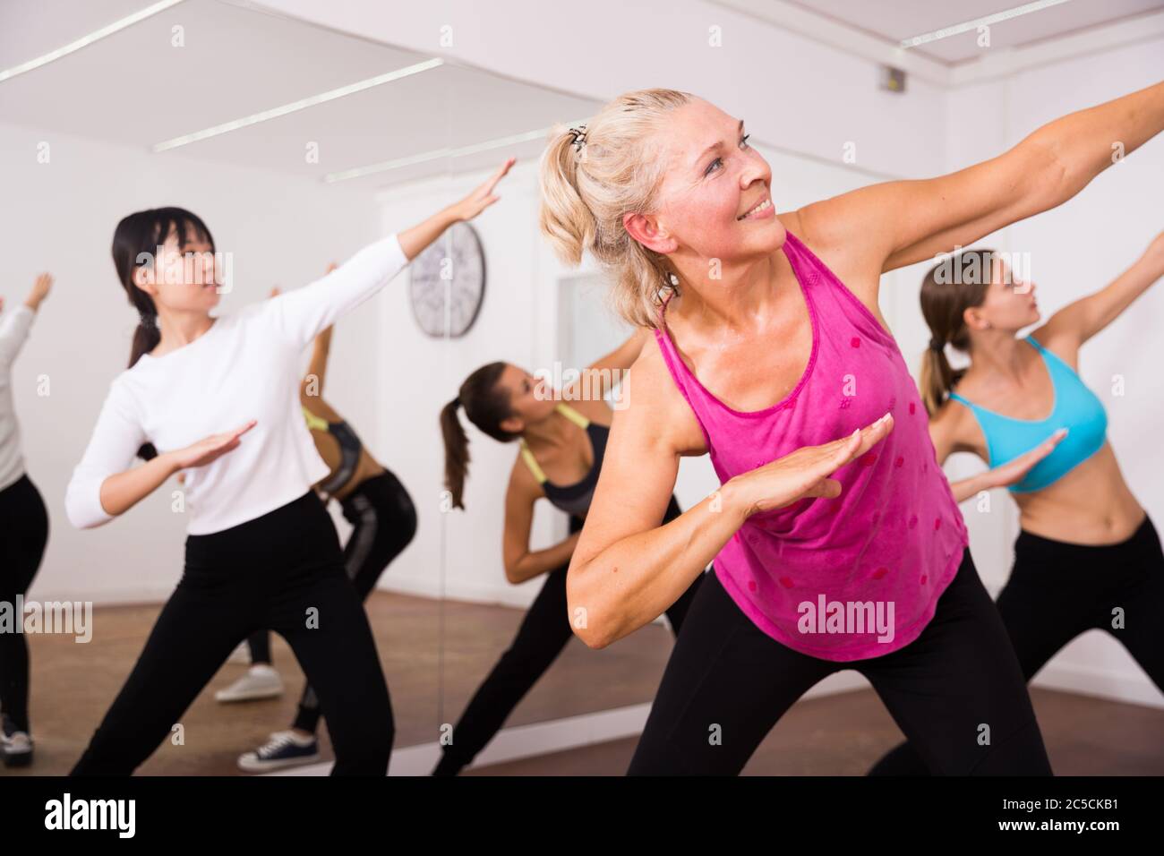 Women dancing aerobics at lesson in the dance class Stock Photo - Alamy