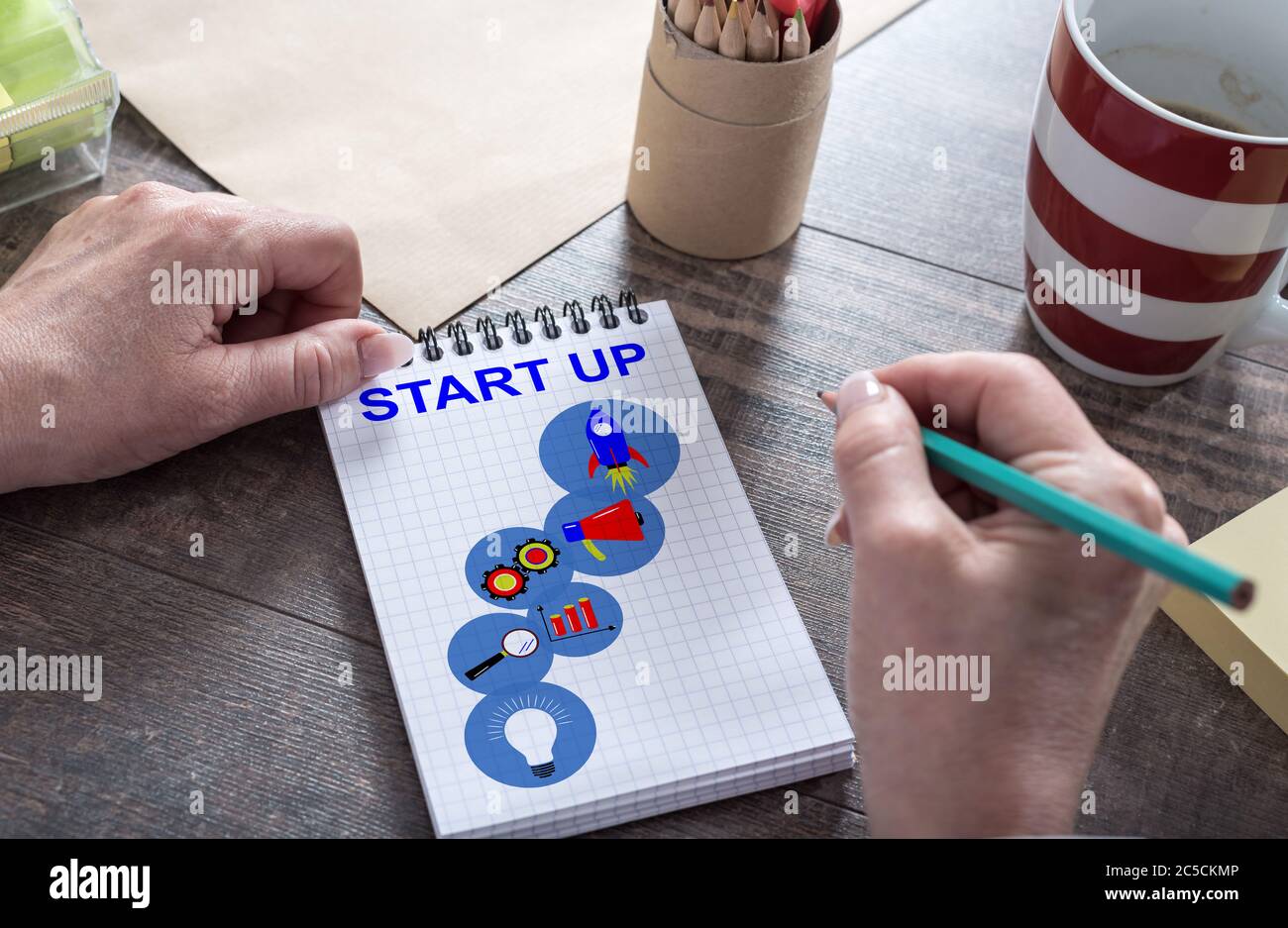 Start up concept drawn on a notepad Stock Photo - Alamy