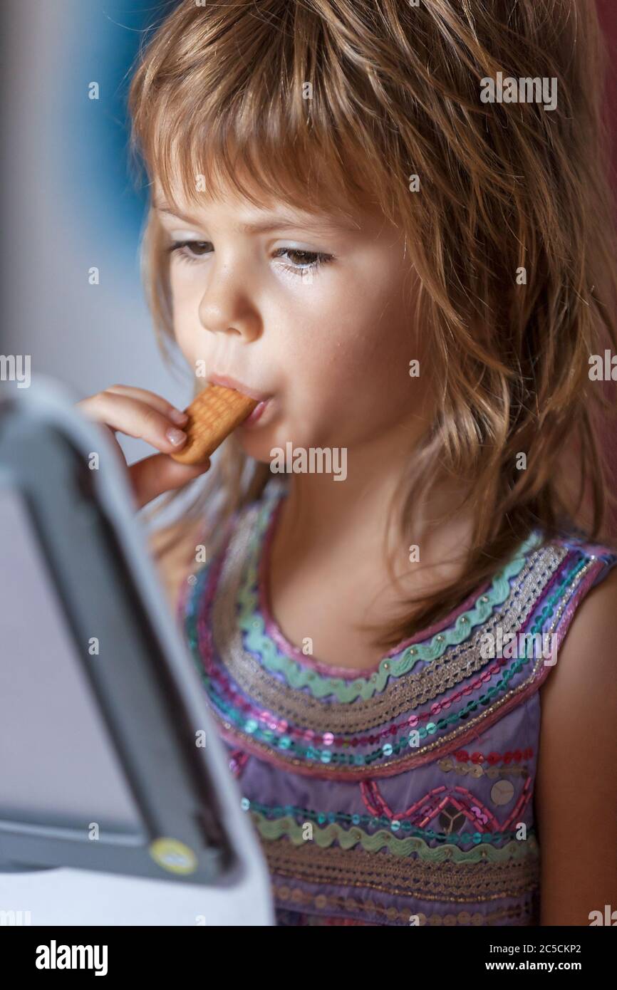 expression of the child's face while watching a cartoon Stock Photo - Alamy