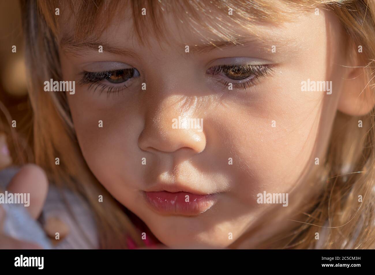 children's face expression until it pays attention Stock Photo - Alamy