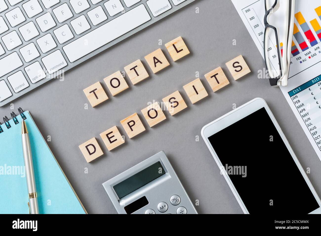 Total deposits concept with letters on cubes Stock Photo - Alamy