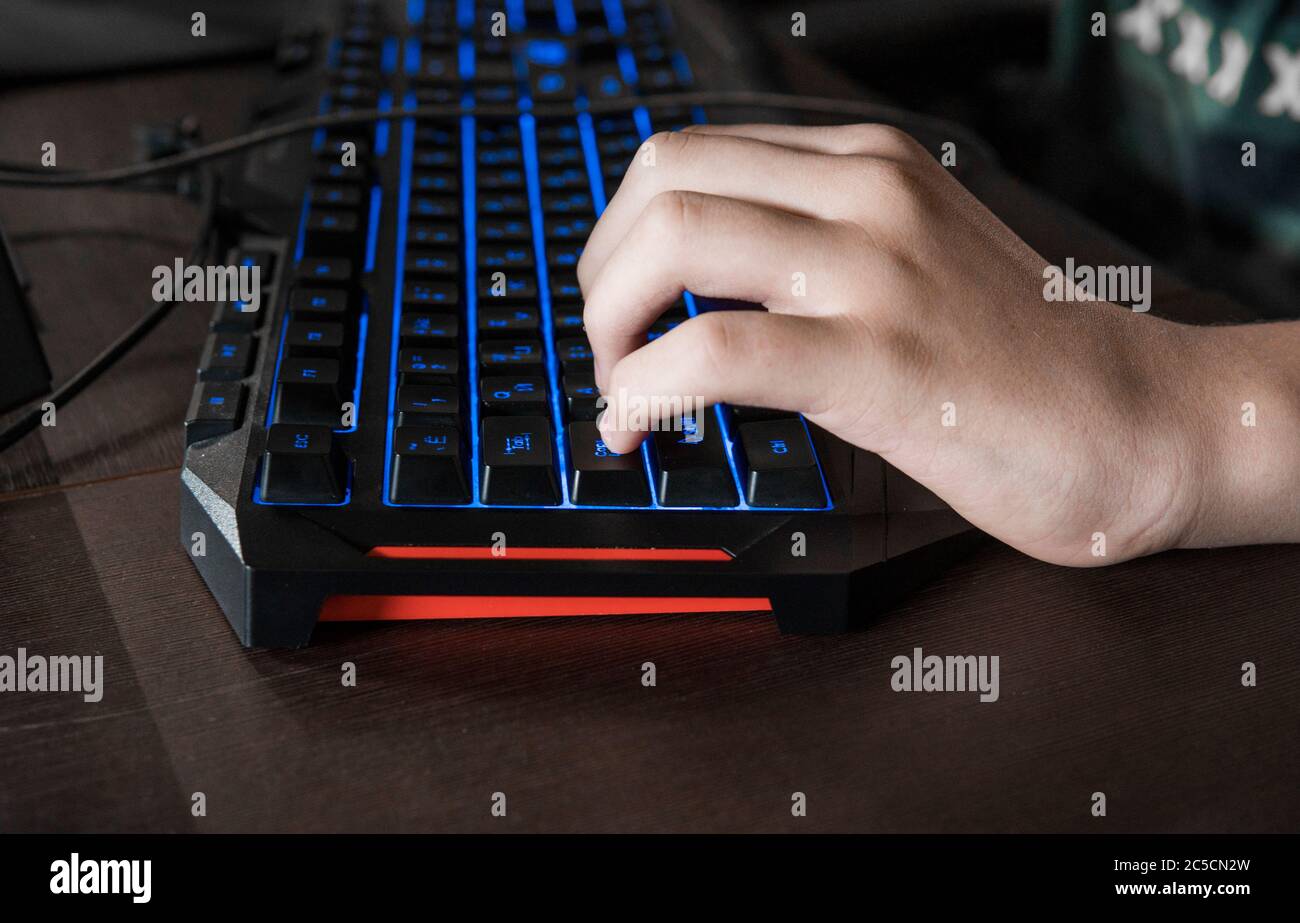 Gamer keyboard with colorful blue lights, modern gamer computer. Blue ...