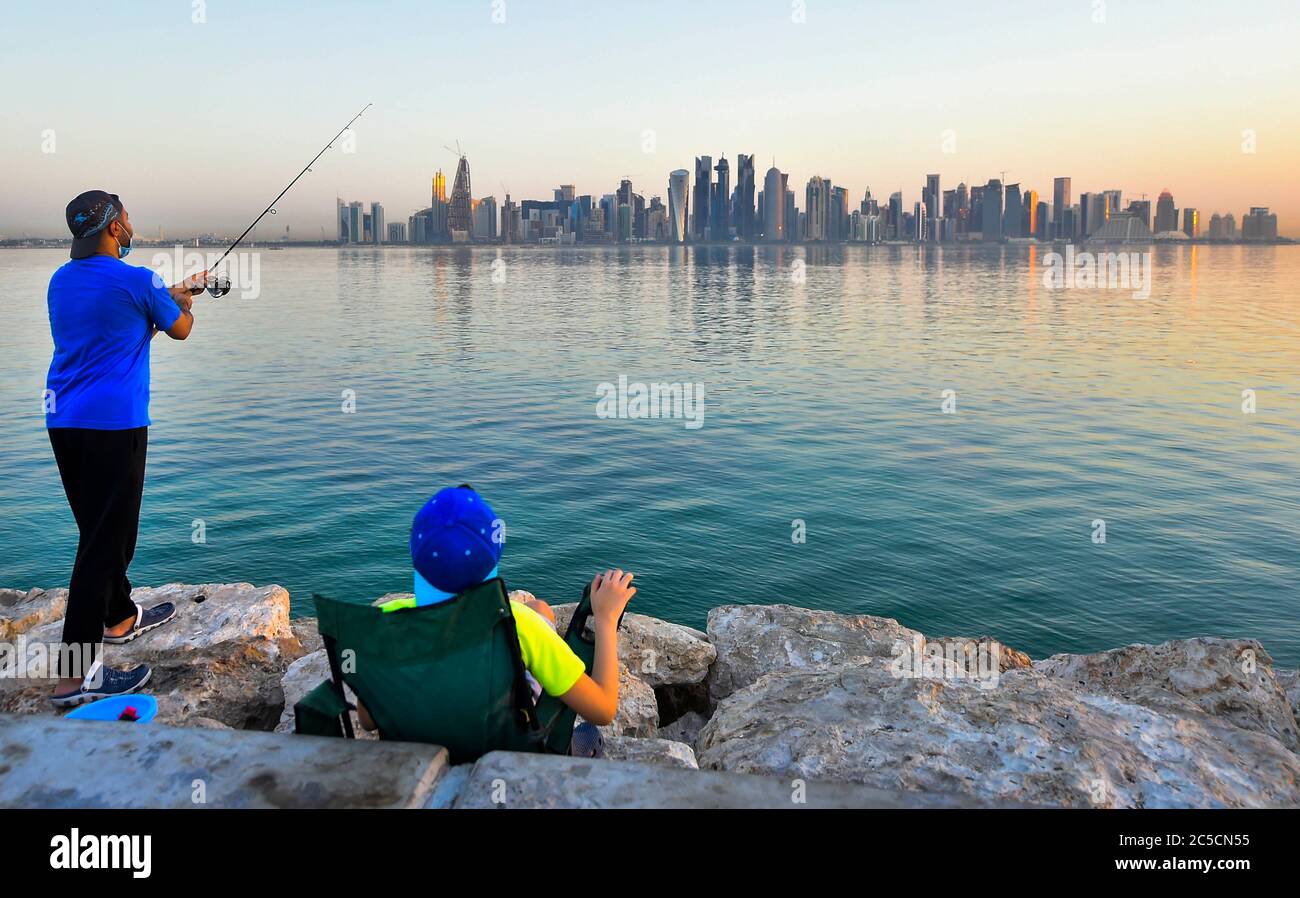 Doha, Qatar. 1st July, 2020. People fish at Doha Corniche in Doha ...