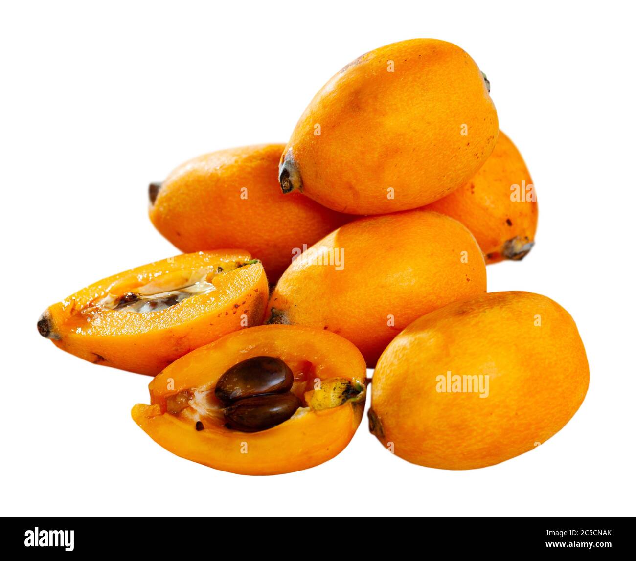 Whole and halved fresh loquat fruit or chinese plum. Isolated over ...