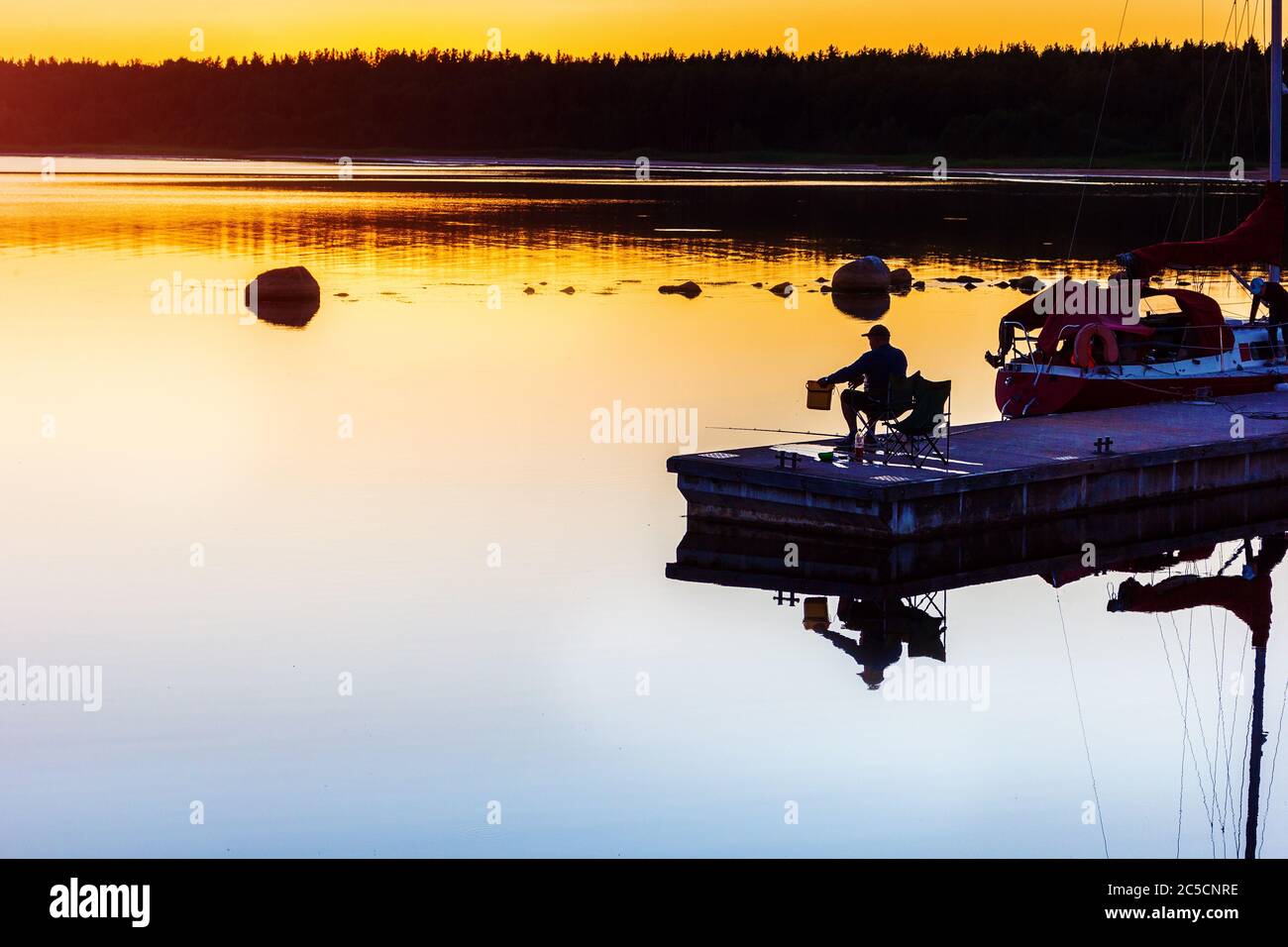 fisherman at sunset. relax harbor happiness lifestyle hobby relax Stock ...