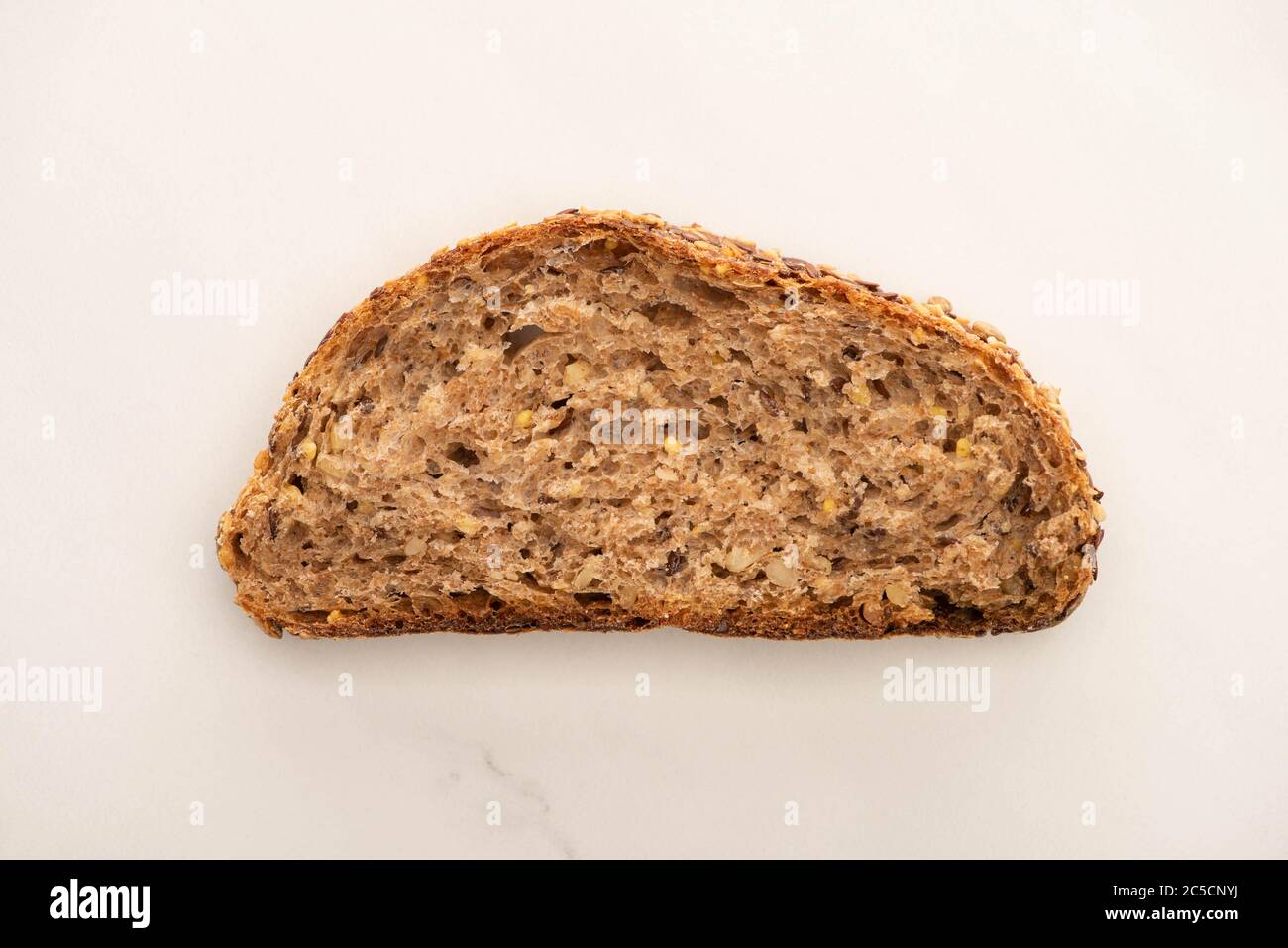 top view of fresh whole wheat bread slice on white background Stock Photo - Alamy