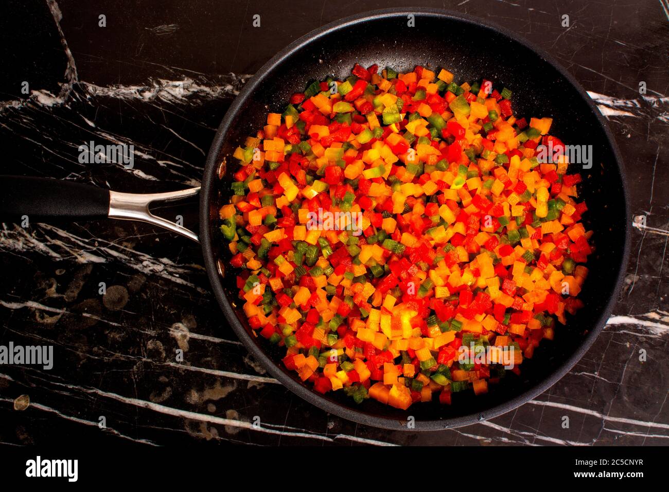 Fried bell peppers on a marble table Stock Photo - Alamy