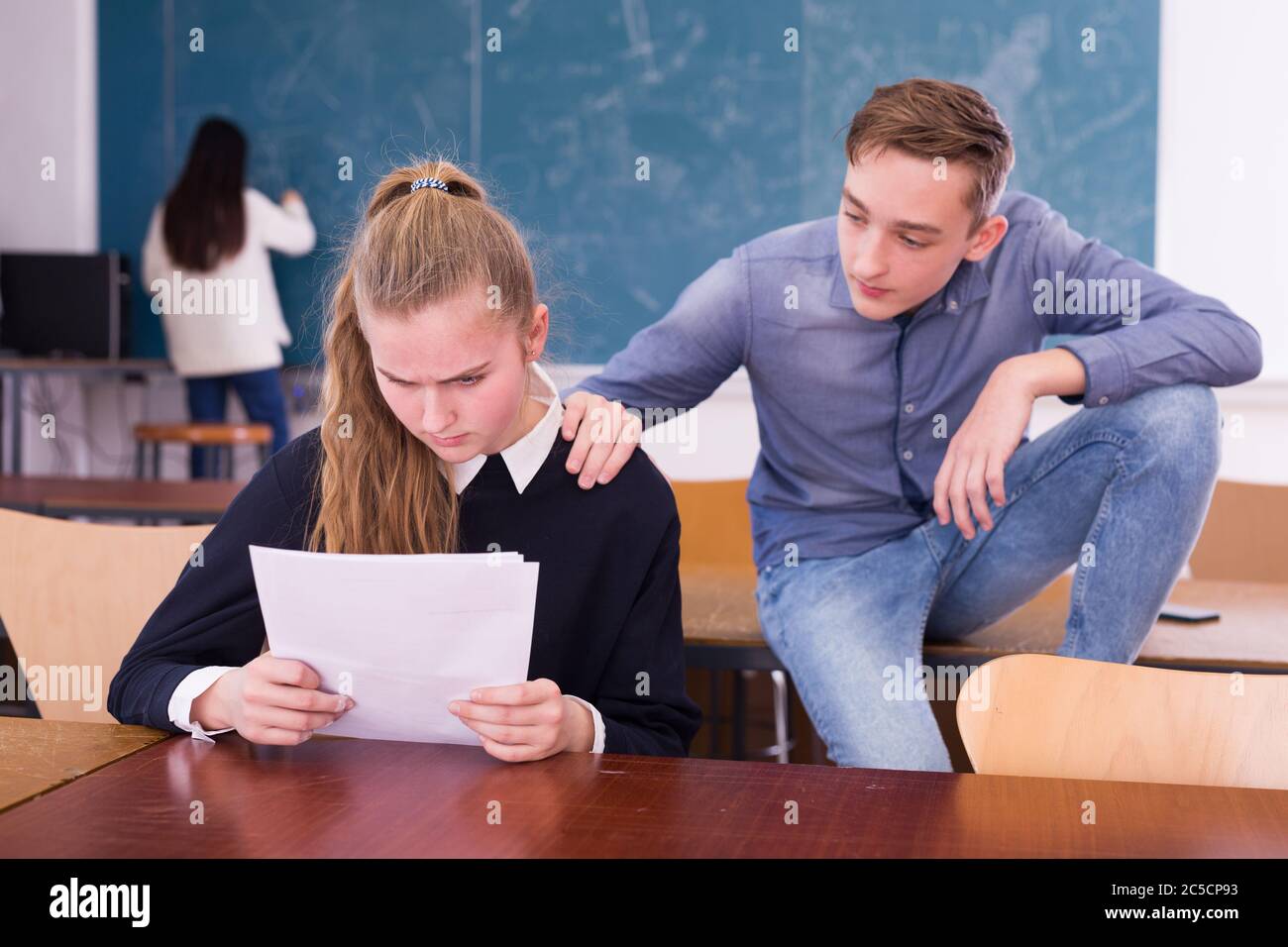 Teenager student friendly soothing girl classmate upset over failure of ...