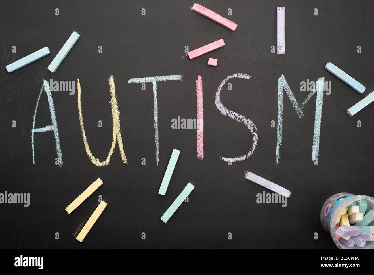 top view of autism lettering on blackboard with colorful chalks Stock ...