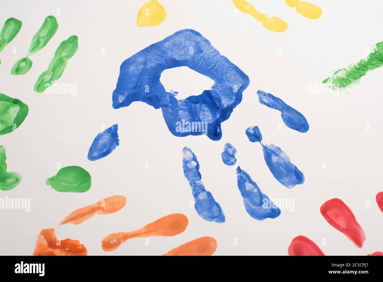 top view of colorful hand prints on white for World Autism Awareness ...