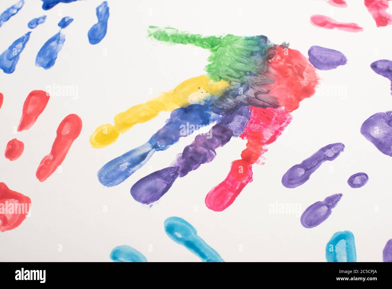 top view of colorful hand prints on white for World Autism Awareness ...