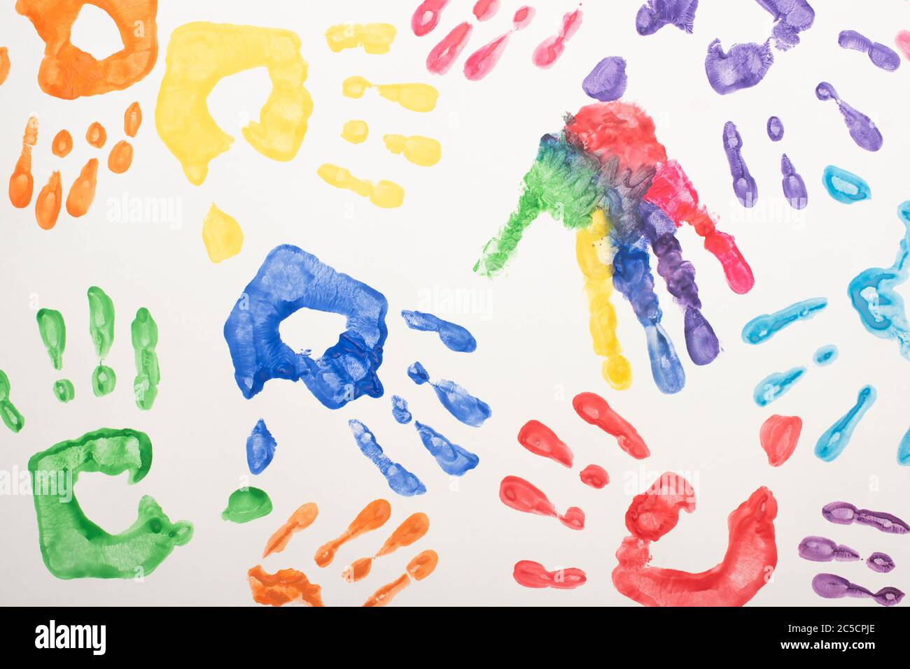 top view of colorful handprints on white for World Autism Awareness Day ...