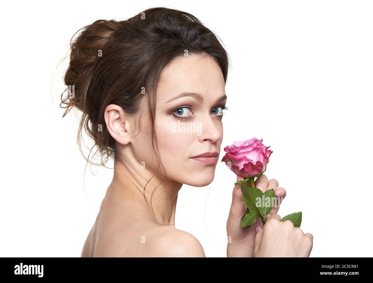 Beauty portrait of a woman with rose flower. Spa and skin care ...