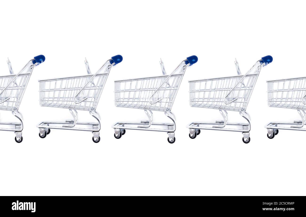 empty shopping carts in the line over white background, mini metal ...