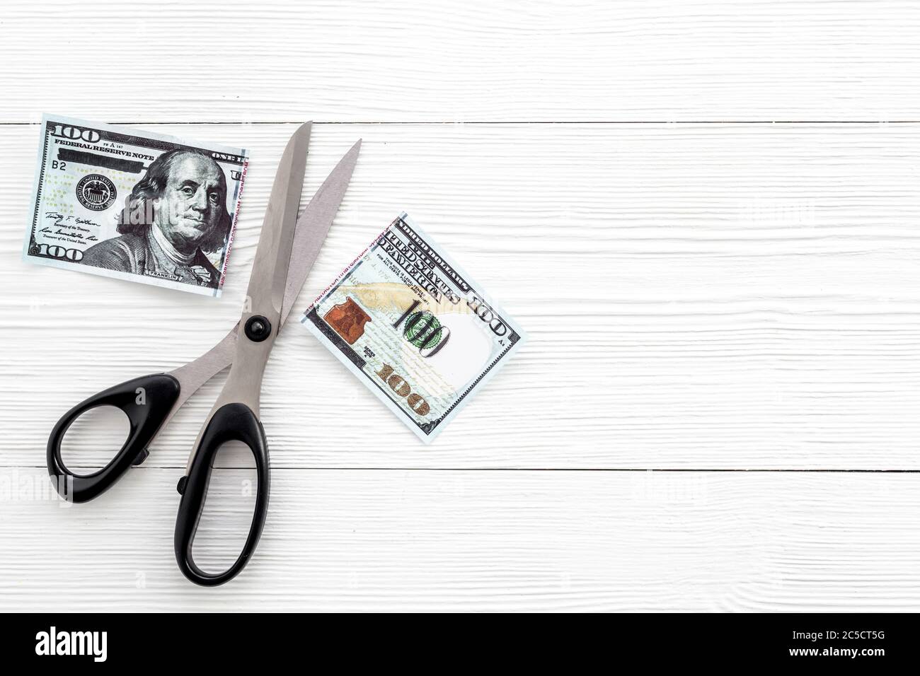 Cutting of US dollar banknote. Economic crisis concept Stock Photo - Alamy