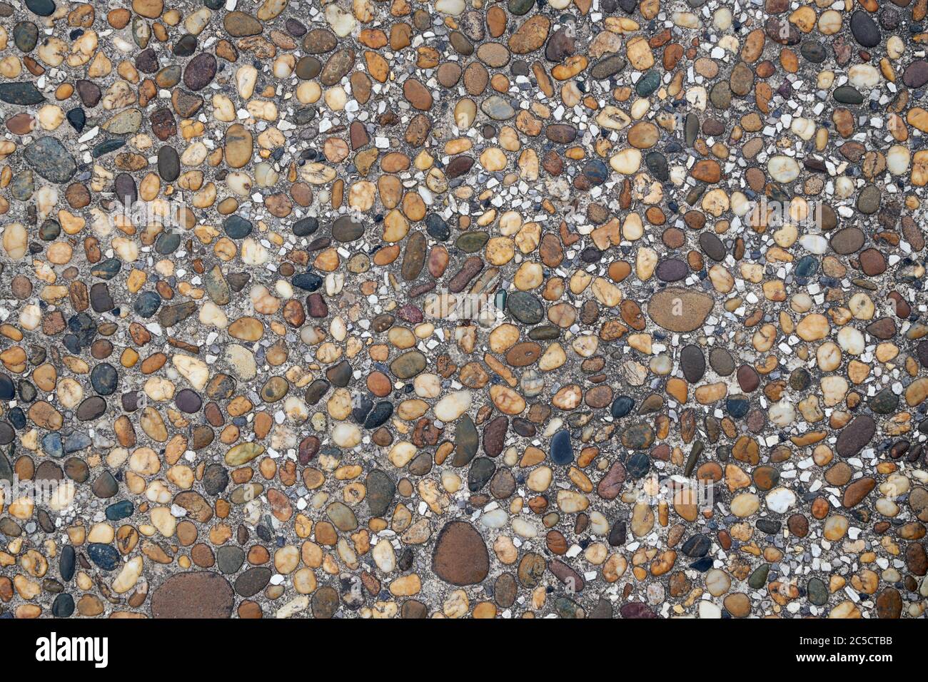 Wall made from polished river pebble stones. Background and texture for ...
