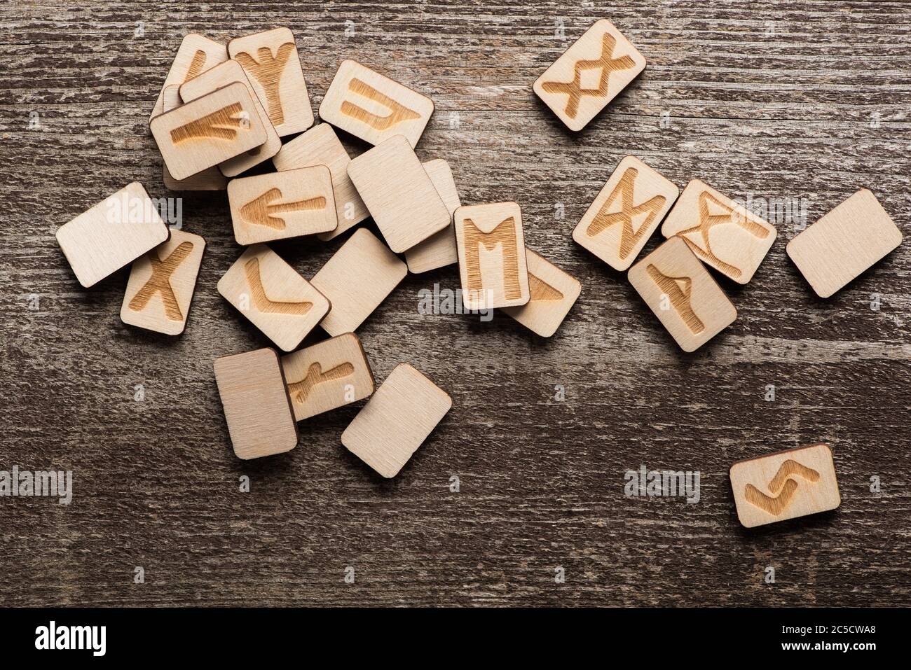 Top view of shamanic runes with symbols on wooden background Stock ...