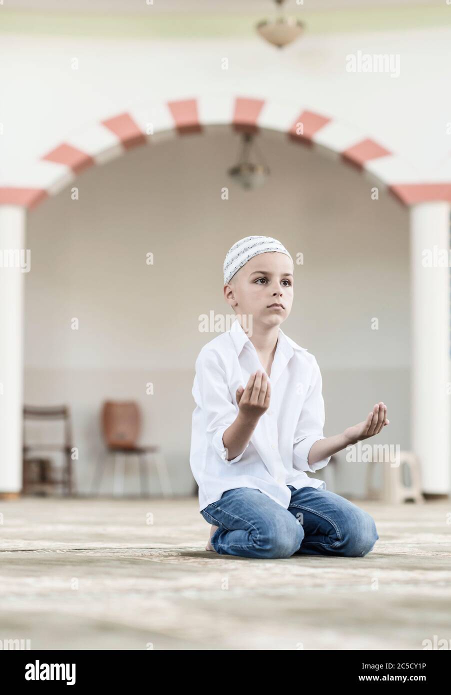 muslim boy prays in a mosque Stock Photo - Alamy