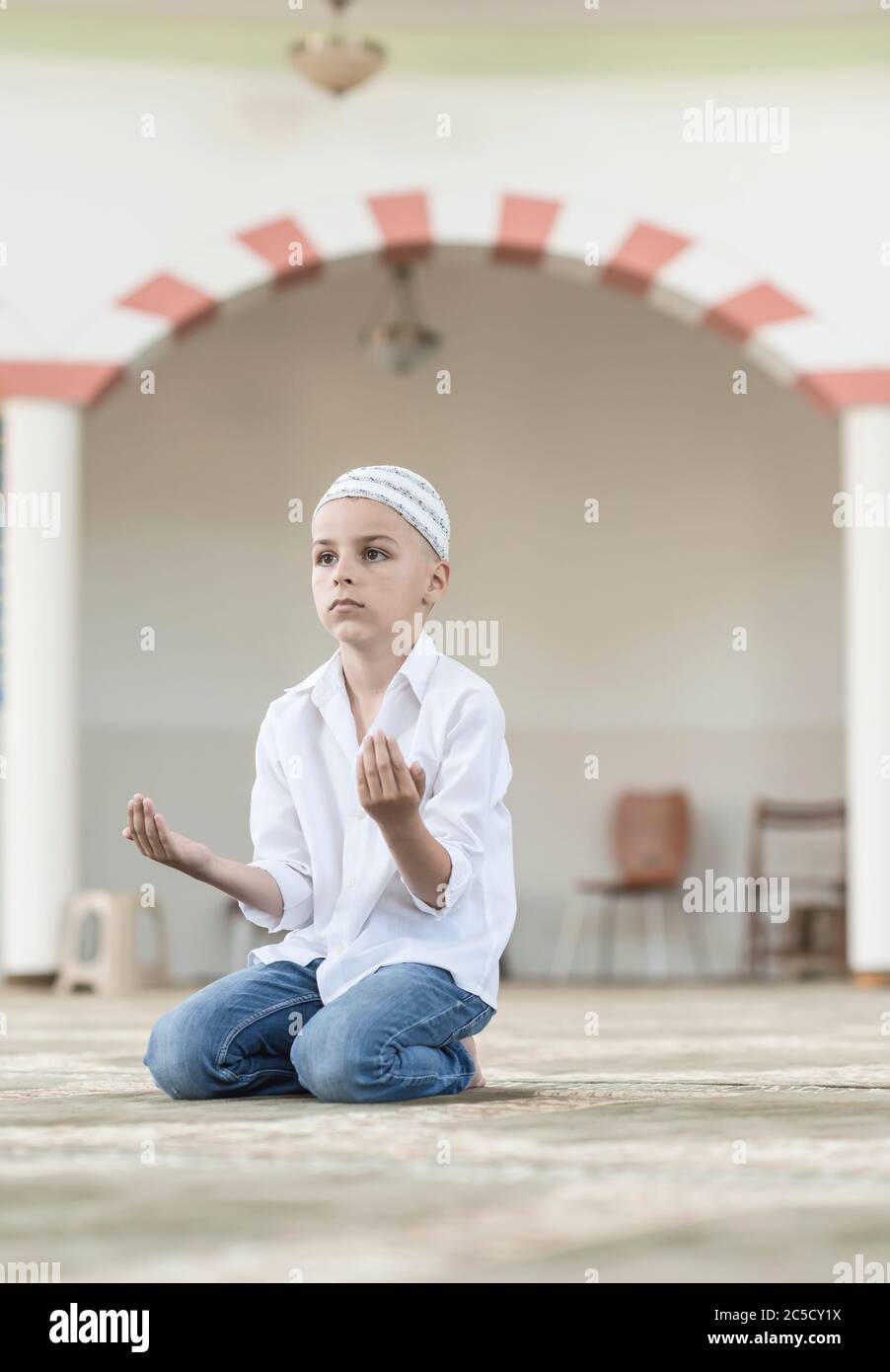 muslim boy prays in a mosque Stock Photo - Alamy