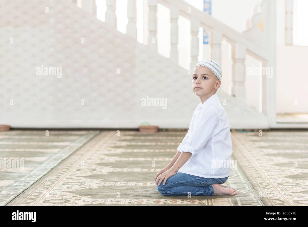 muslim boy prays in a mosque Stock Photo - Alamy