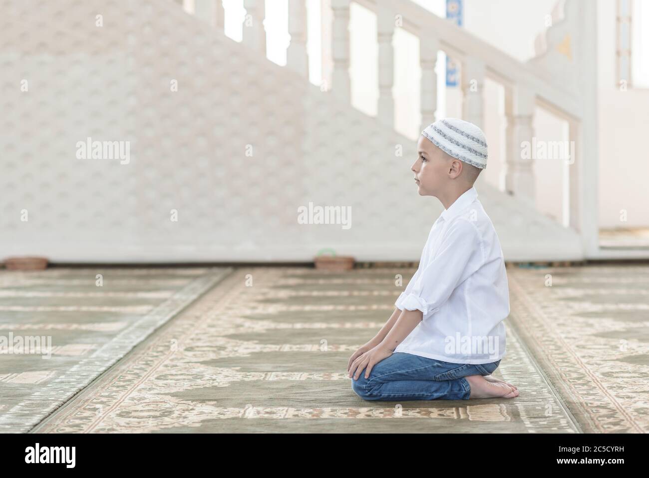 muslim boy prays in a mosque Stock Photo - Alamy