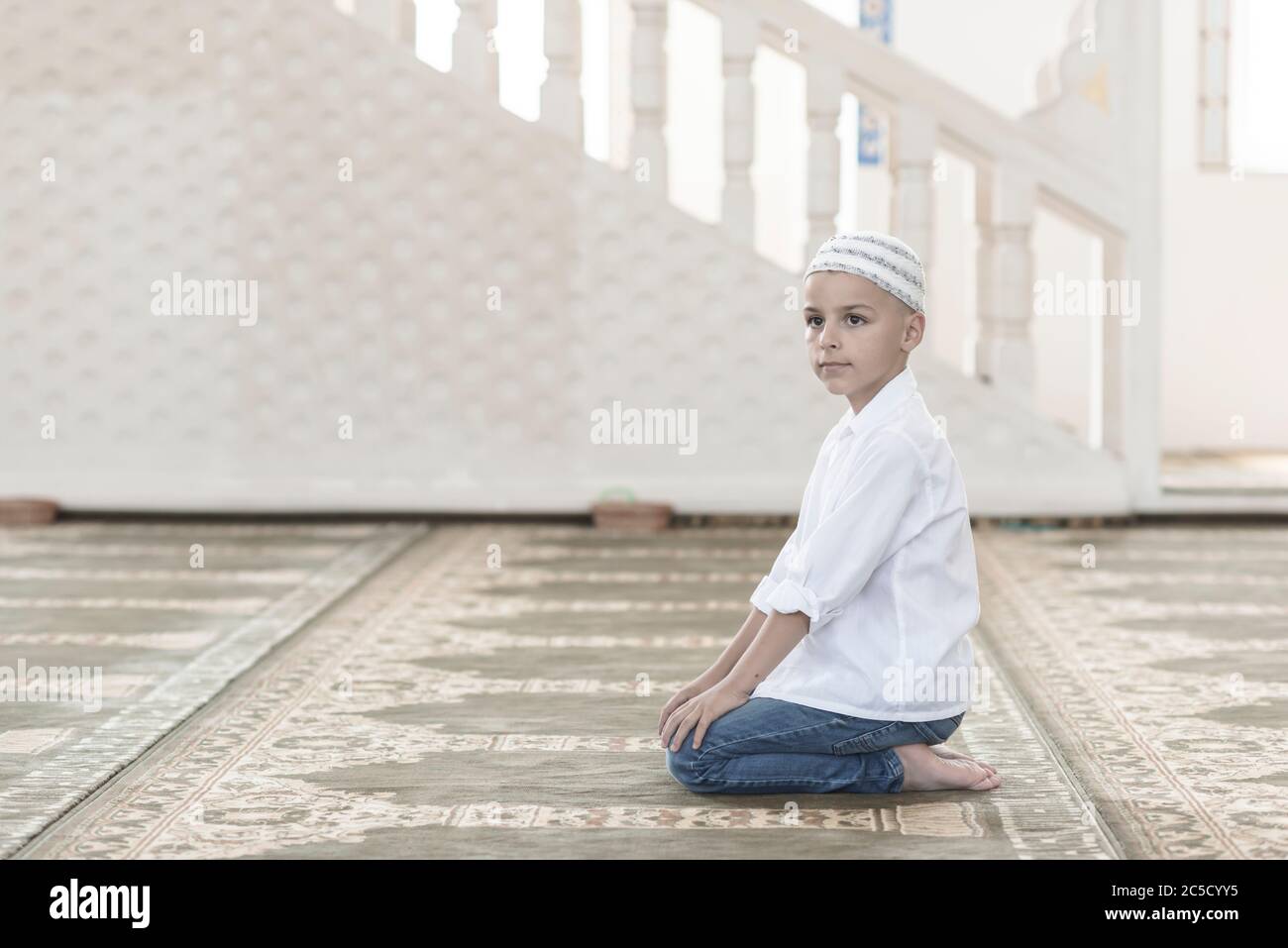 muslim boy prays in a mosque Stock Photo - Alamy