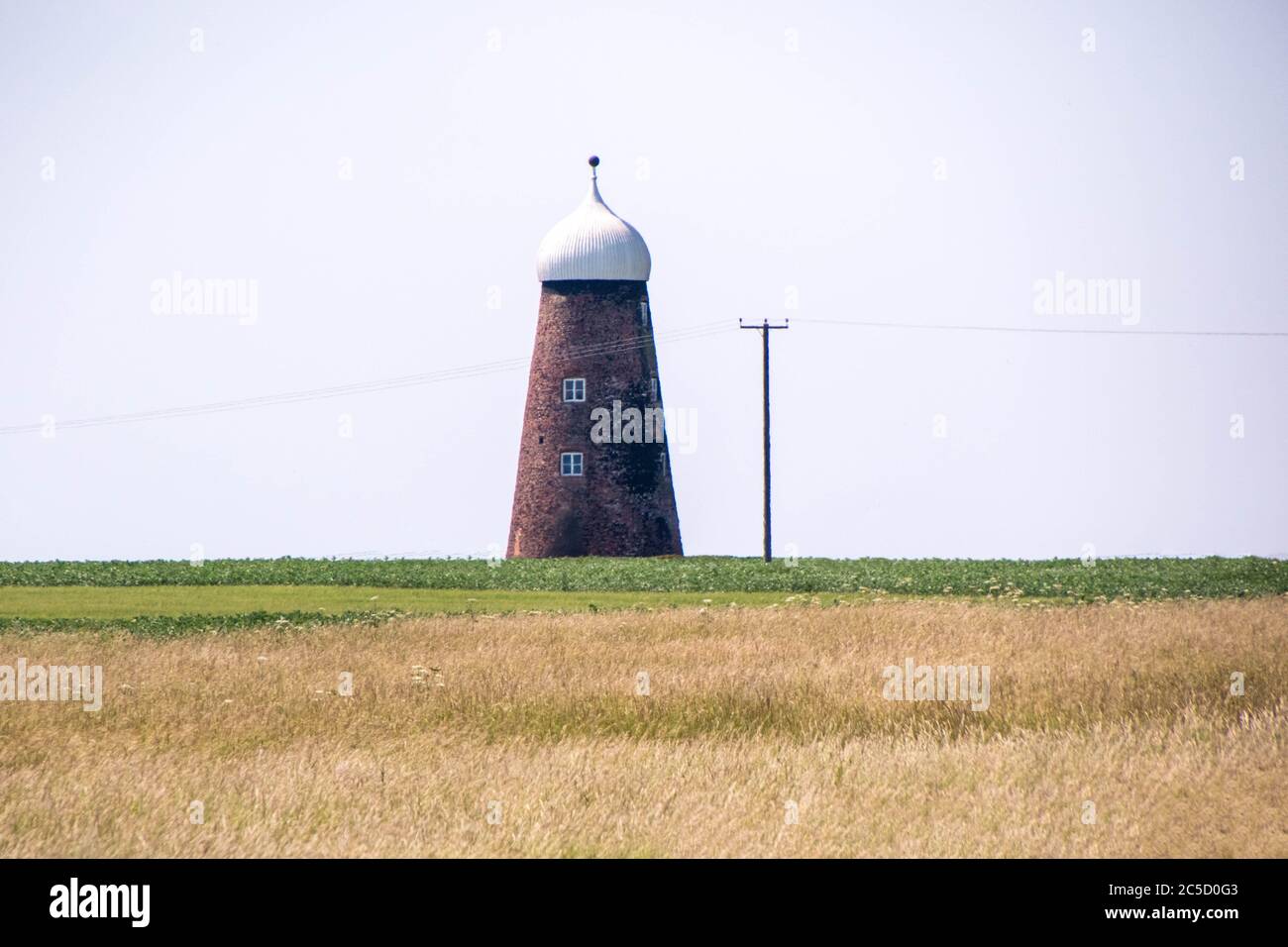 An odd shaped building in the middle of the British countryside ...