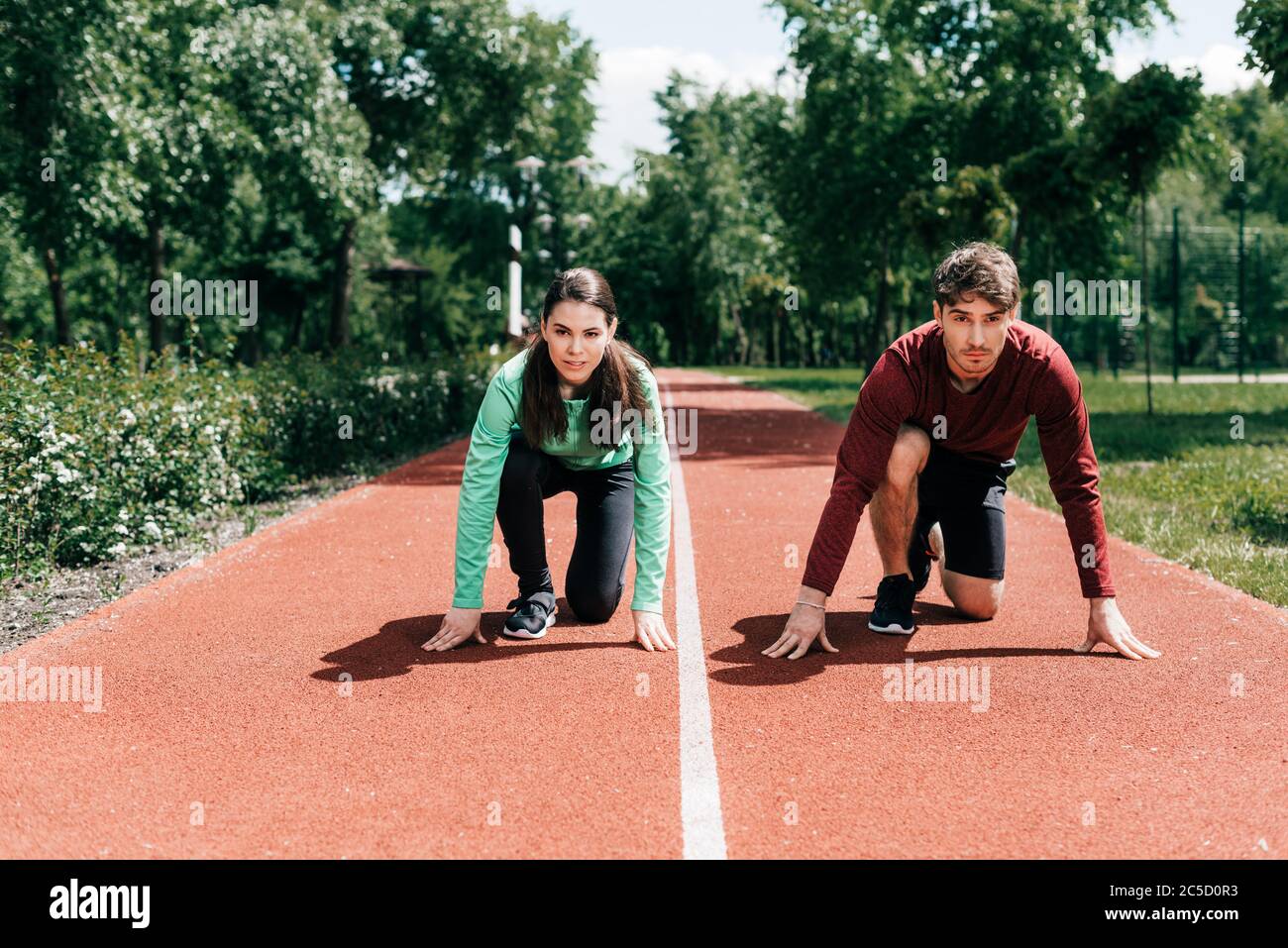 Two runners in starting position hi-res stock photography and images ...