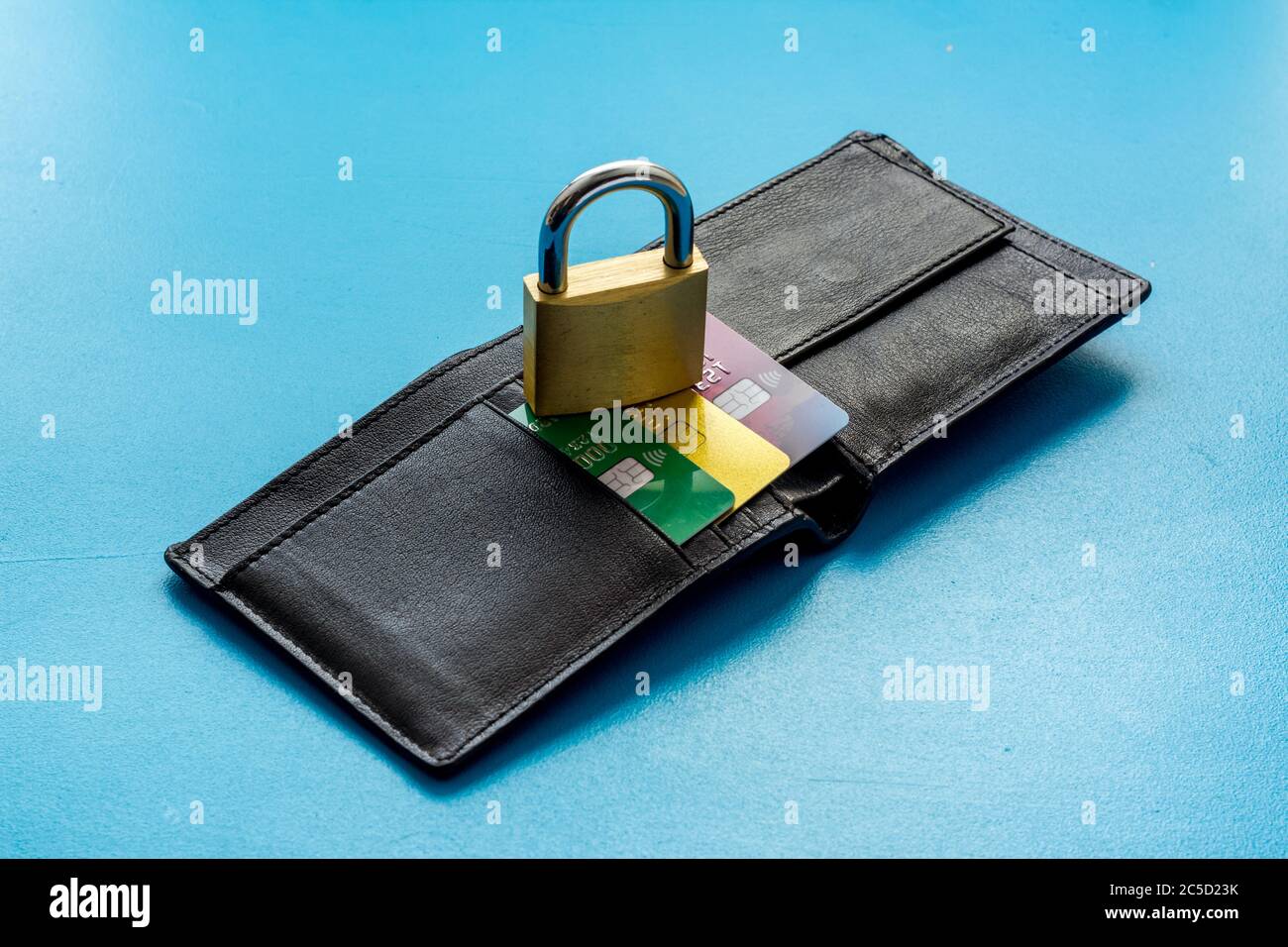 Credit card data security concept with lock on blue table Stock Photo ...